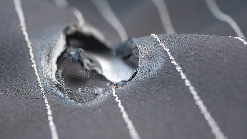 Damaged Fabric with a Tear Displayed Under Close Examination Stock ...