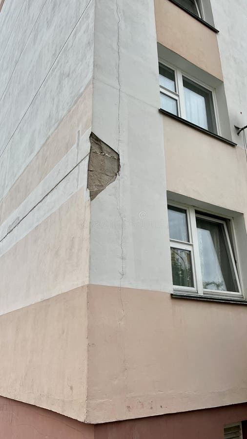 Damaged Facade of a Residential Building. Chipped Plaster on the Facade ...