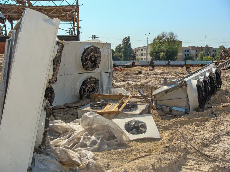 Damaged Industrial Fans and Debris at a Construction Site, with a ...