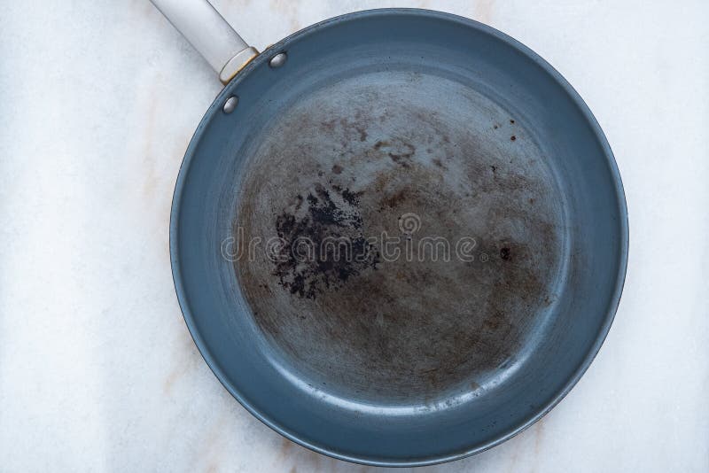 Damaged Non Stick Skillet on the Kitchen Counter Stock Photo - Image of ...