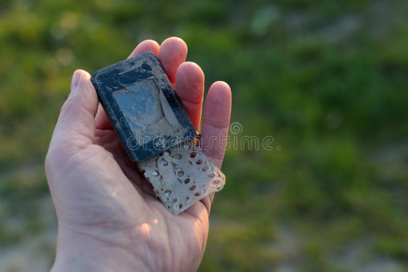 Damaged Old Cell Phone in Hand - E-waste Recycling Issue Stock Photo ...