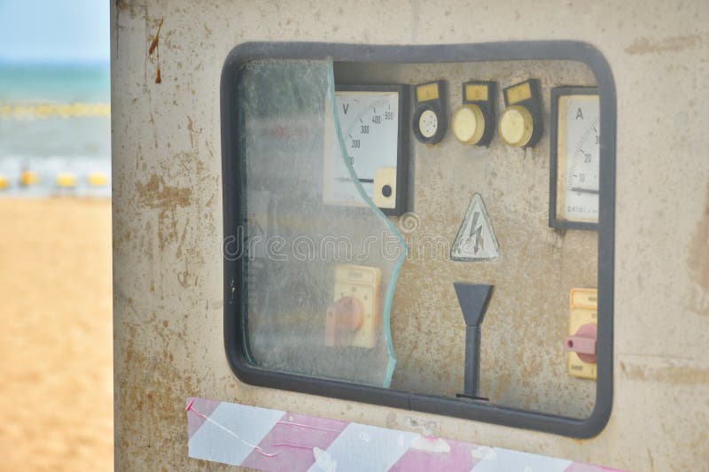 A Damaged and Rusted Electrical Control Panel Has Broken Glass Shards ...