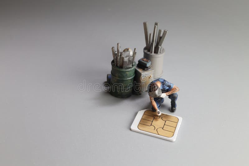 A Damaged Sim Card and Miniature Figure Model Scene Stock Photo - Image ...