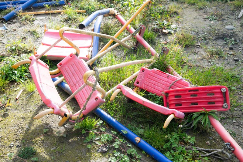 Damaged Playground Swing on the Ground Stock Photo - Image of abandoned ...