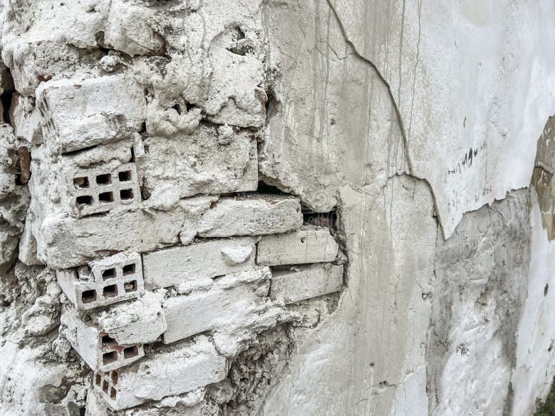 Damaged Wall of a Building with Broken Bricks Stock Image - Image of ...