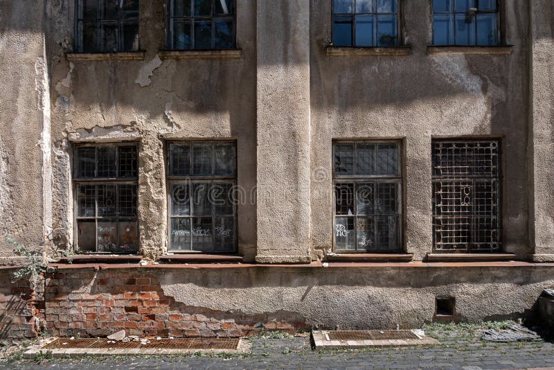 Damaged Wall of an Old Building with Windows Stock Image - Image of ...
