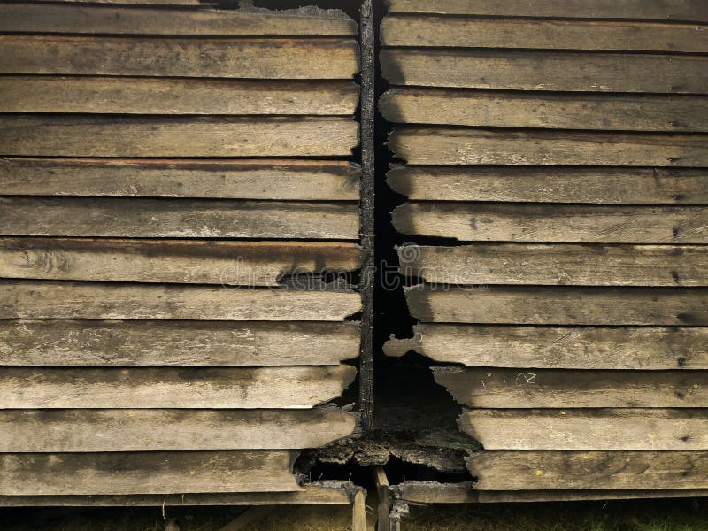 Damaged Wooden Wall with Burn Marks and Structural Decay Stock Image ...
