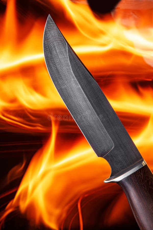 Damascus Steel Knife on the Fire Background. Stock Image - Image of ...