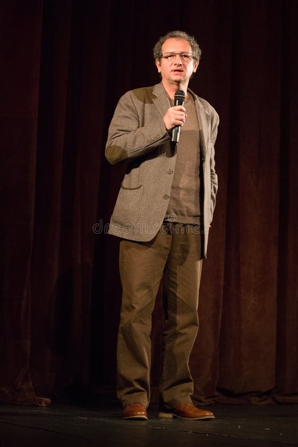 Dan Puric giving a speech editorial photography. Image of microphone ...