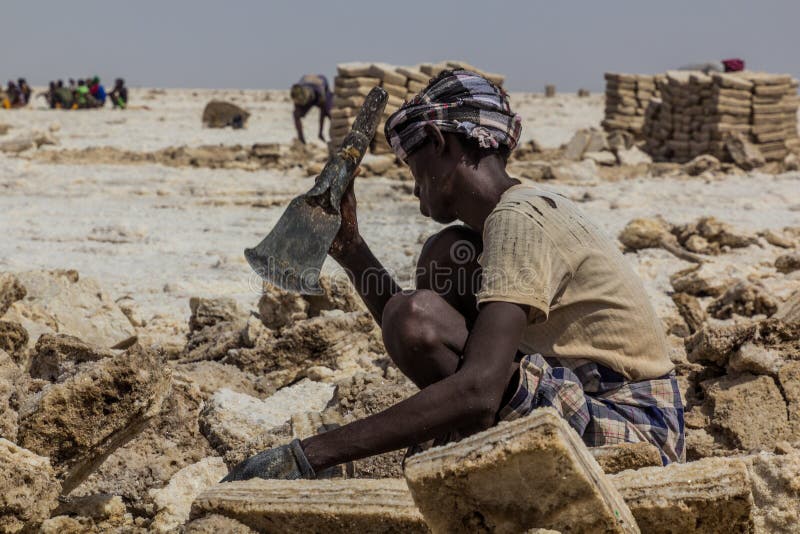 DANAKIL, ETHIOPIA - MARCH 24, 2019: Afar Tribe Salt Miner in the ... DANAKIL, ETHIOPIA - MARCH 24, 2019: Afar Tribe Salt Miner in the ...