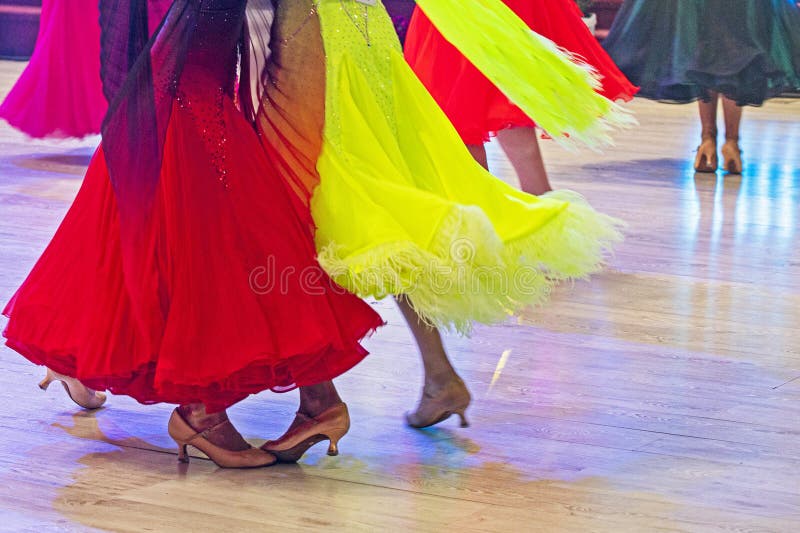 Dance on High Heels Dance in a Lush Crowd in Multi-colored Red Dresses ...