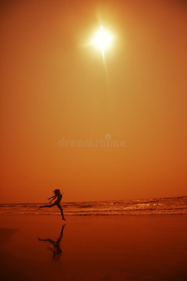 Dance in orange night stock photo. Image of beach, horizon - 14357242
