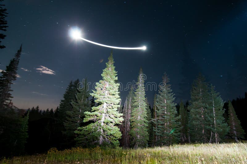 Dance of Two Moons stock image. Image of mountains, night - 64197981