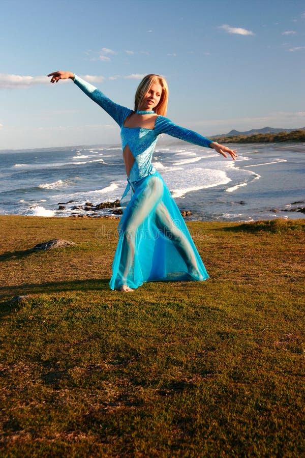 Dancer on cliff stock photo. Image of woman, blue, clouds - 164672