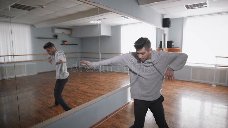 Dancer is Dancing Near the Mirror. Light Dance Class with a Window ...
