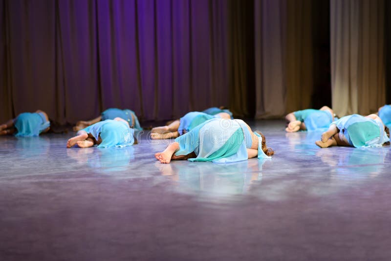 Dramatic Dance Pose by Blonde Woman Against Yellow Stock Photo - Image ...