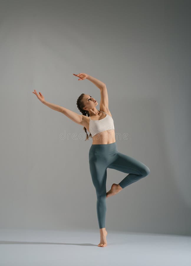 Dancer Performing a Graceful Pose in a Minimalist Studio Setting Stock ...