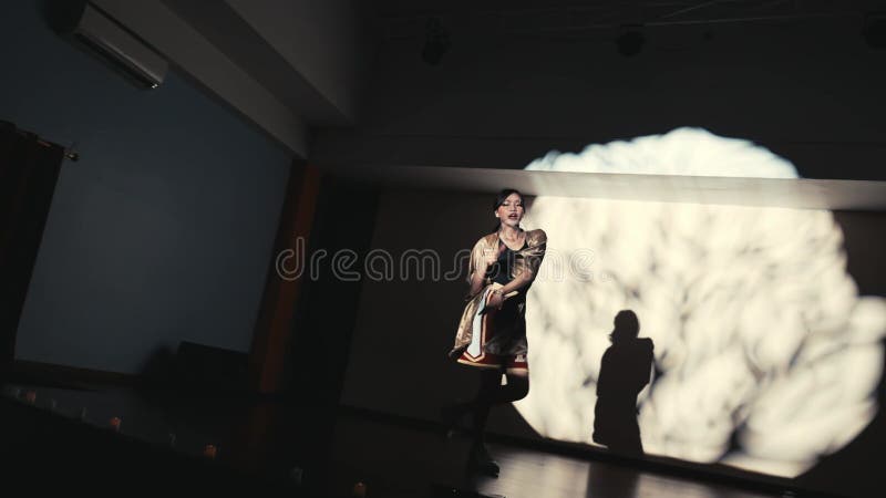 Dancer in Spotlight with Dramatic Shadow on Stage Stock Video - Video ...