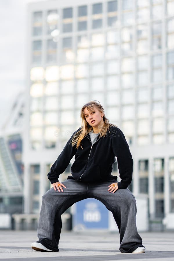 Dancer Striking a Powerful Pose in Urban Setting on a Sunny Day Stock ...