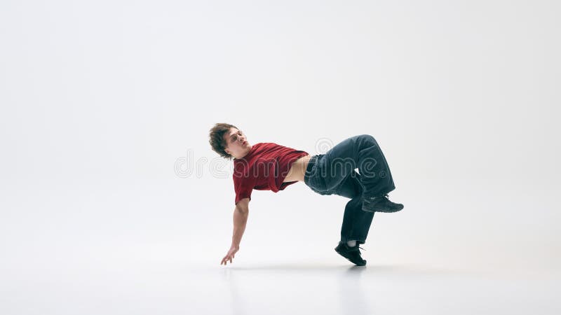 Dancer Twisting Mid-motion, Balancing on One Hand, Intense Focus in ...