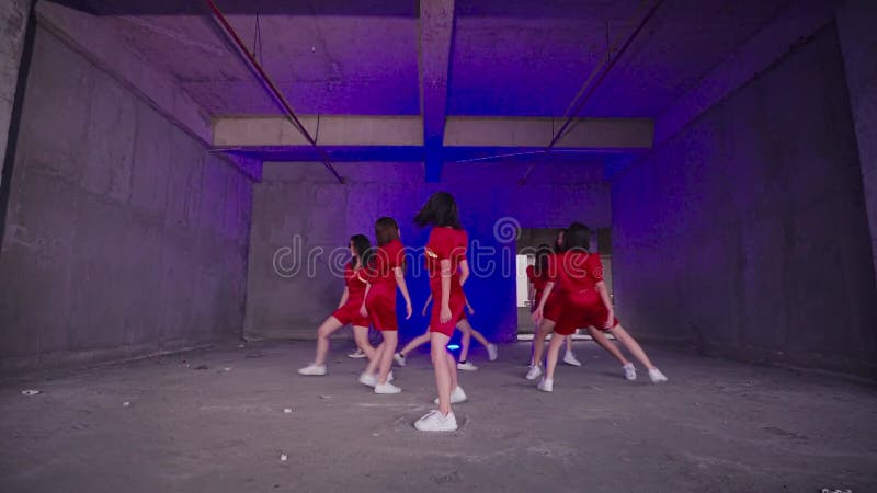 Dancers in Red Dresses Performing in Industrial Space Stock Footage ...