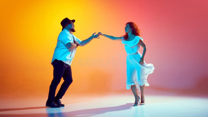 Dancers Work on Precise Coordination and Timing in Neon Light Against ...