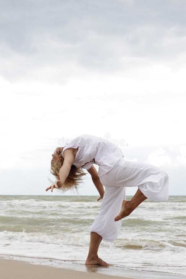 Dancing on the beach stock image. Image of beautiful - 10652999
