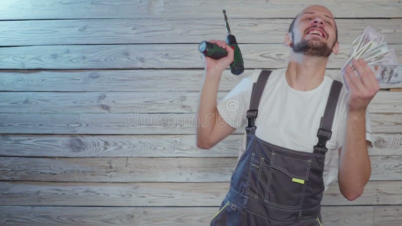 Dancing Construction Worker with Money and Drill in His Hand Stock ...