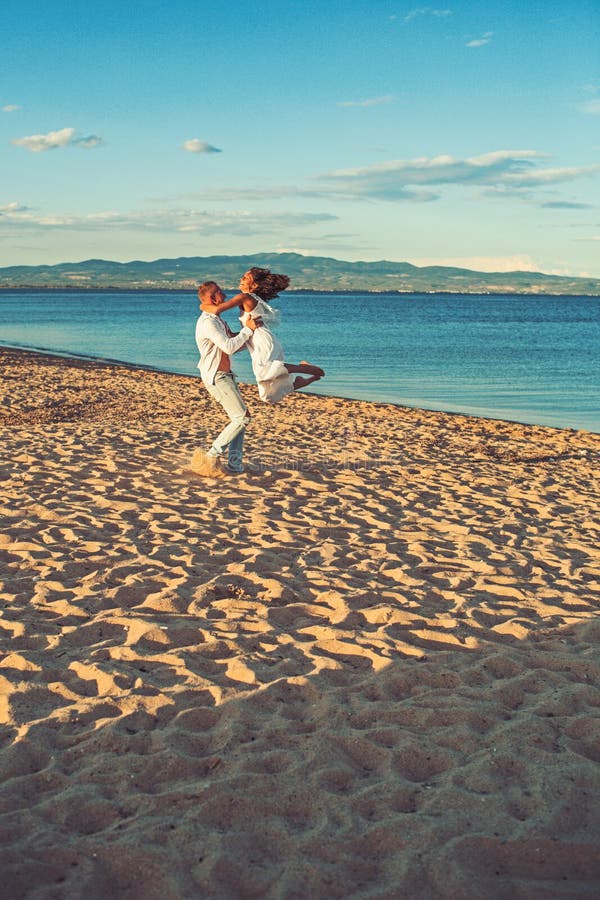 Dancing Couple on Sandy Beach. Dancing and Having Fun with Happy Young ...