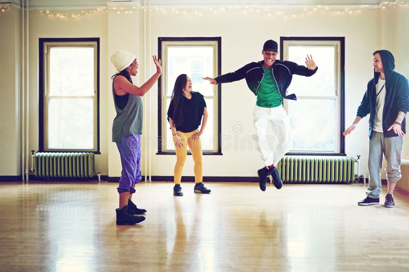 Dancing is a Full Body Experience. a Group of Young Friends Dancing ...