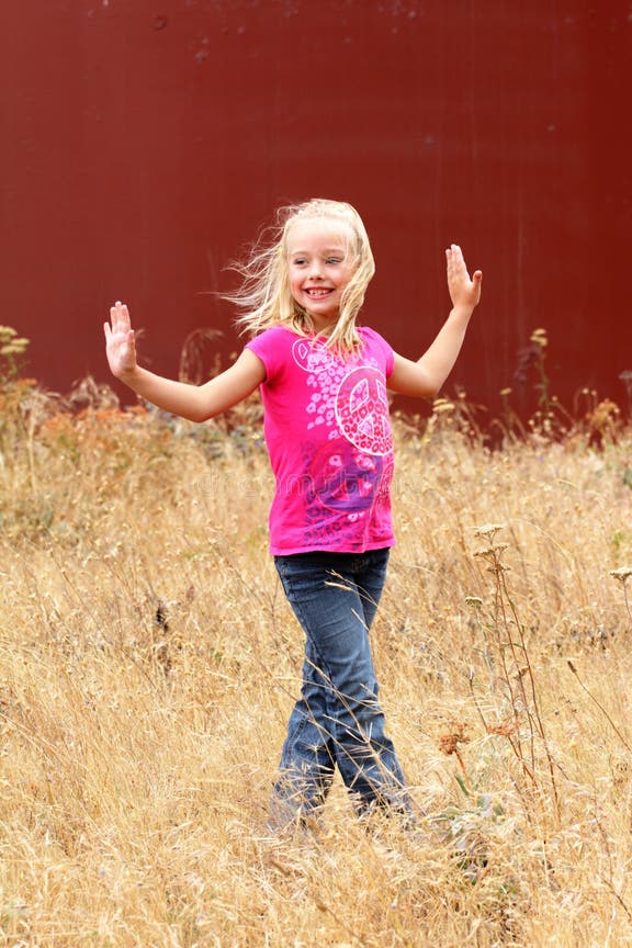 Dancing in the grass. stock image. Image of adorable - 20525031