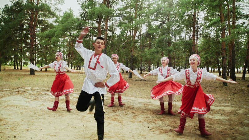 Dancing Group of People in the Park during an Outdoor Light Event. Low ...