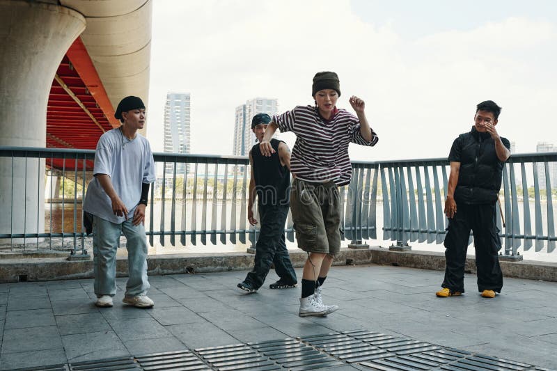 Dancing Group Under Bridge Performing Street Routine Stock Photo ...