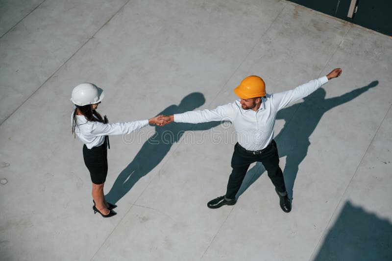 Dancing, Having Fun. Man with Woman are Working on the Construction ...