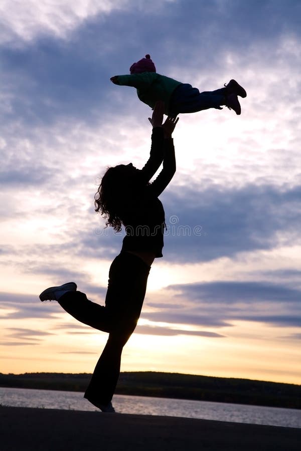 Mother And Baby Dancing Outside Stock Photo - Image of attractive ...