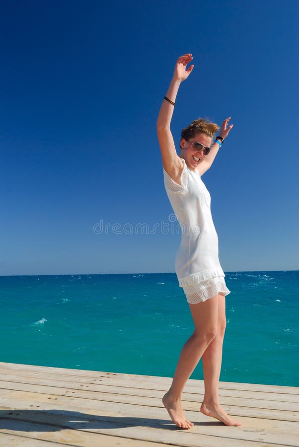 Dancing near the sea stock image. Image of beach, holiday - 12995189