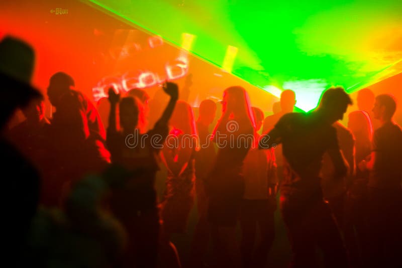 Dancing People in Red Disco Light Stock Photo - Image of event ...