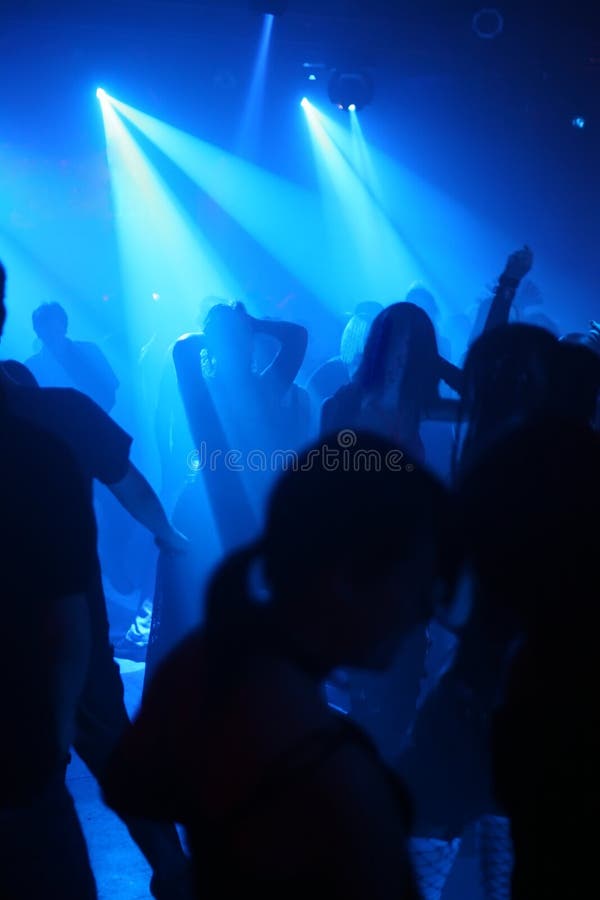 Dancing People in Red Disco Light Stock Photo - Image of event ...