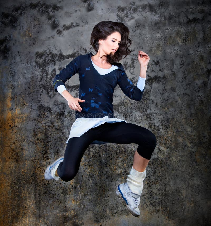 Dancing woman, jumping up. stock image. Image of grey - 24975355