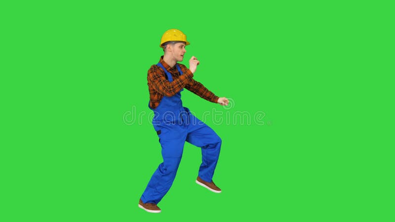 Construction Worker in Helmet Dancing on a Green Screen, Chroma Key ...