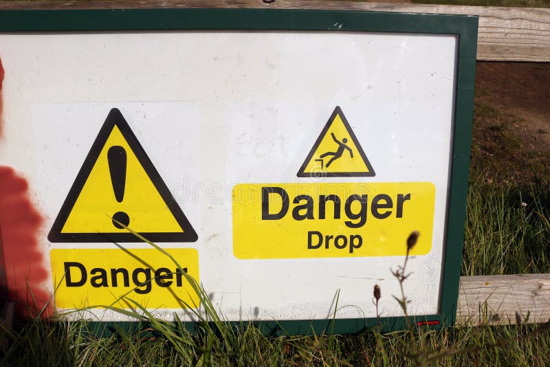 Warning Drop Off Sign Near Cliff By Waters Edge Stock Photo - Image of ...