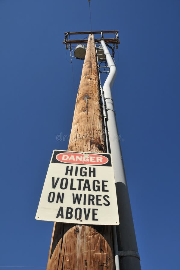 Danger High Voltage Wires Above Sign on Pole Stock Image - Image of ...