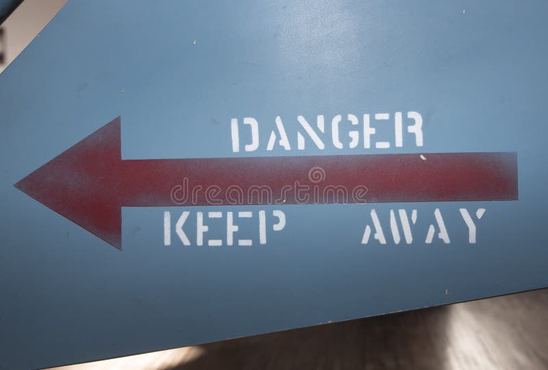Danger Keep Away Sign with Direction Arrow Stock Photo - Image of ...