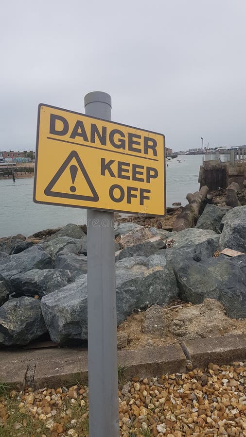 Danger Keep Off Sign beside Sea Harbour. Stock Photo - Image of wall ...