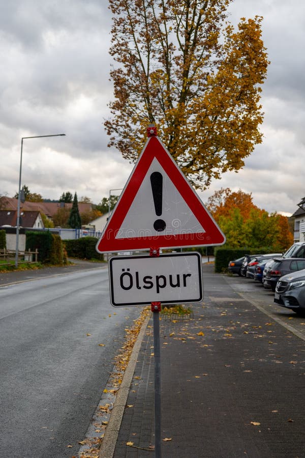 Danger from Oil Slick: Warning Sign on the Side of the Road Stock Image ...