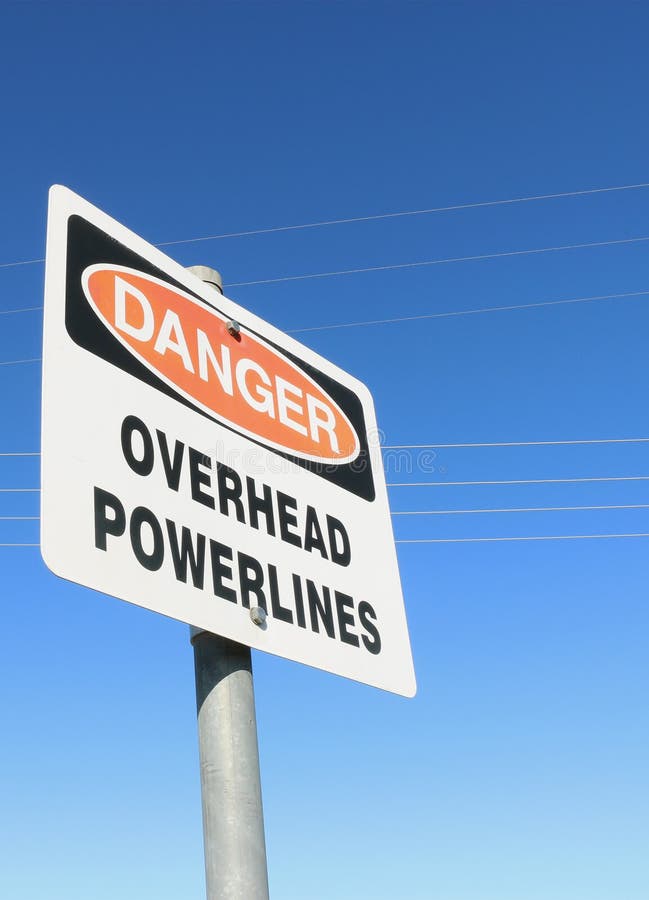 Danger, Overhead Powerlines Warning Sign with Visible Power Lines Stock ...