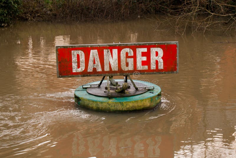 Danger Sign on Fast Flowing River Stock Image - Image of danger ...