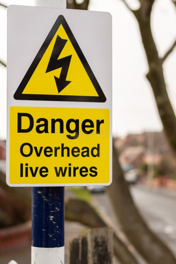 Danger sign overhead wires stock image. Image of danger - 217369987