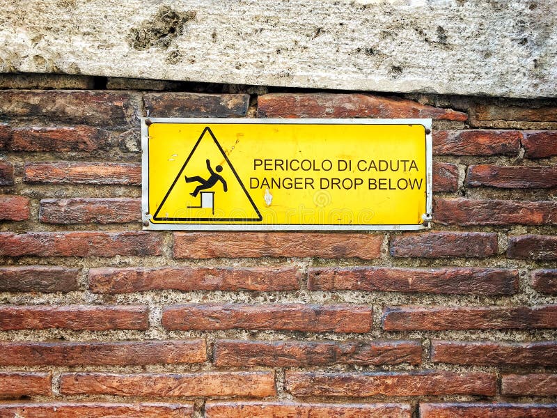 Danger sign in Rome stock photo. Image of bricks, sign - 76697240