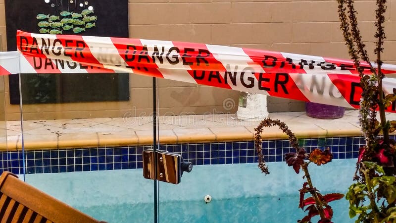 Danger Tape on Gate of Empty Swimming Pool Being Repaired with Upside ...